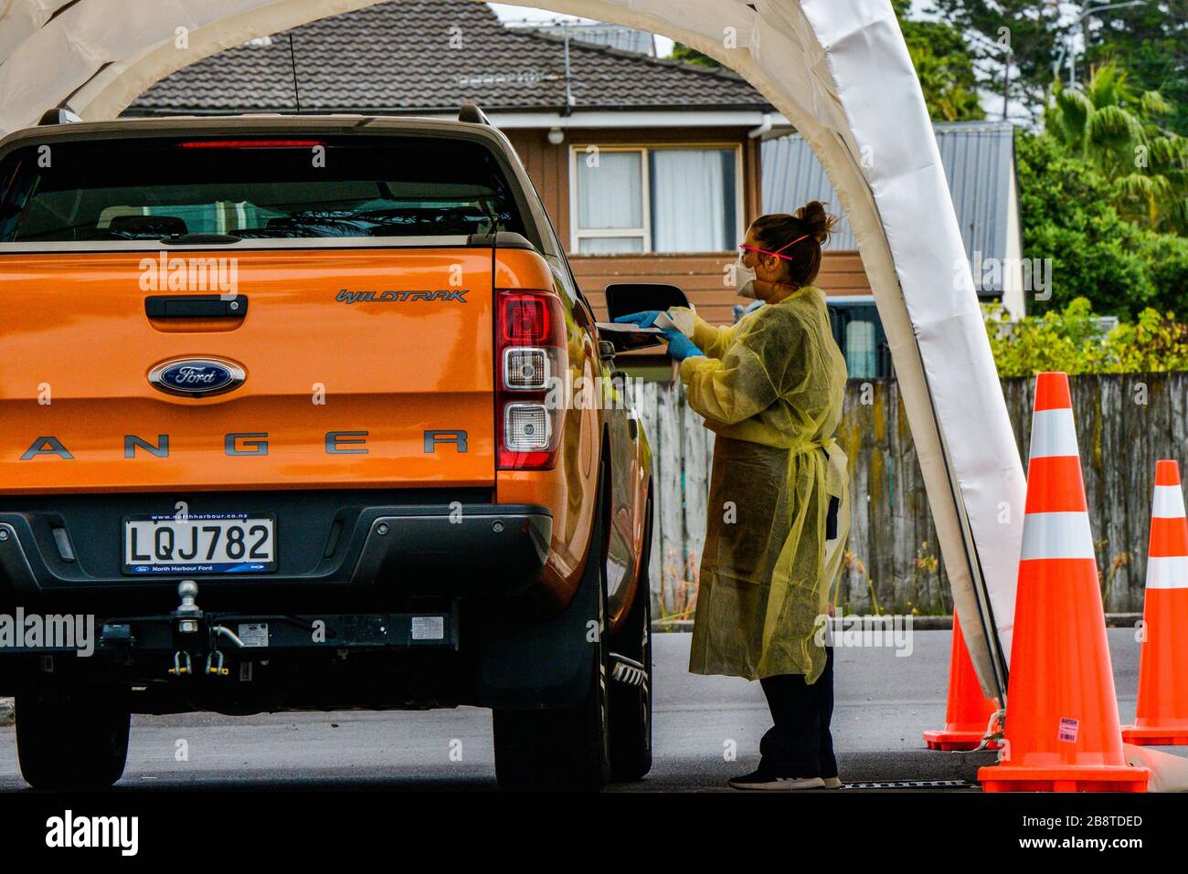 Aukland, New Zealand. 23rd Mar, 2020. A medical worker conducts quick ...