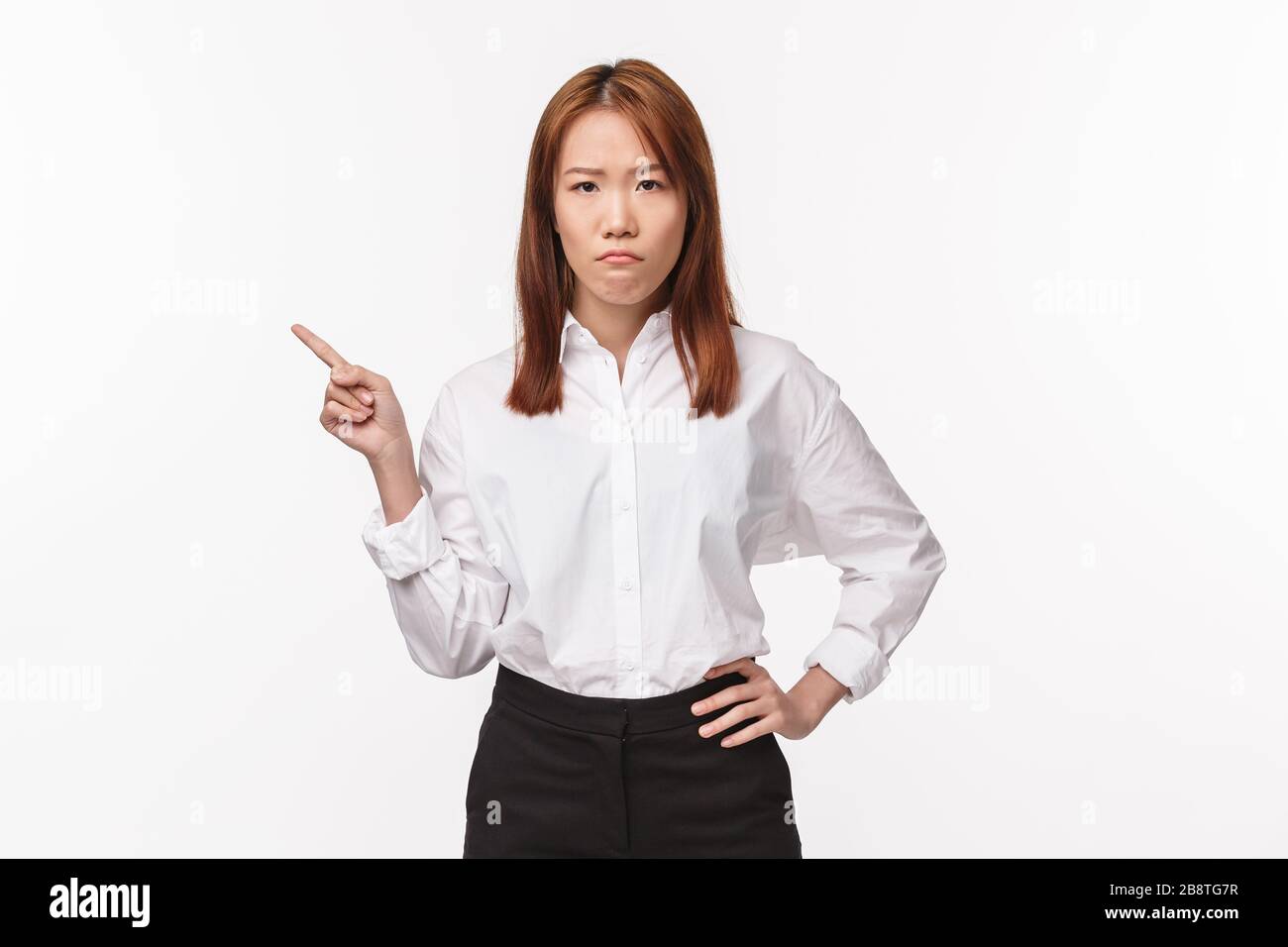 Portrait of angry and displeased asian female entrepreneur pouting and ...