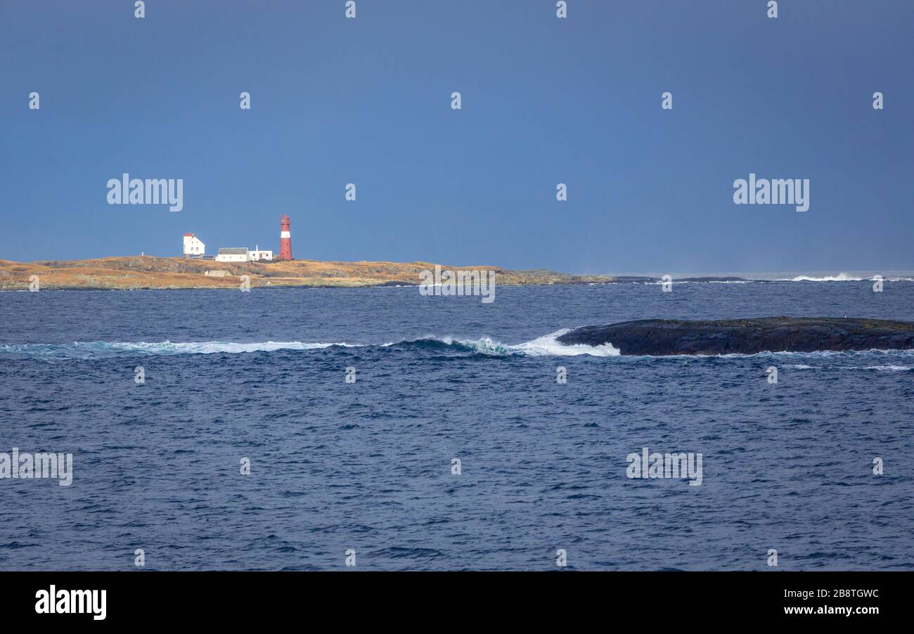 Sunbeam and rainbow over the lighthouse between Torvik and Ålesund on ...