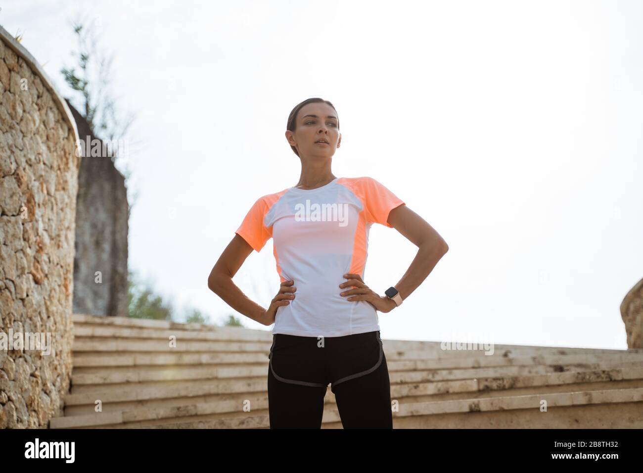 Fitness sport girl resting after intensive run, young attractive runner ...