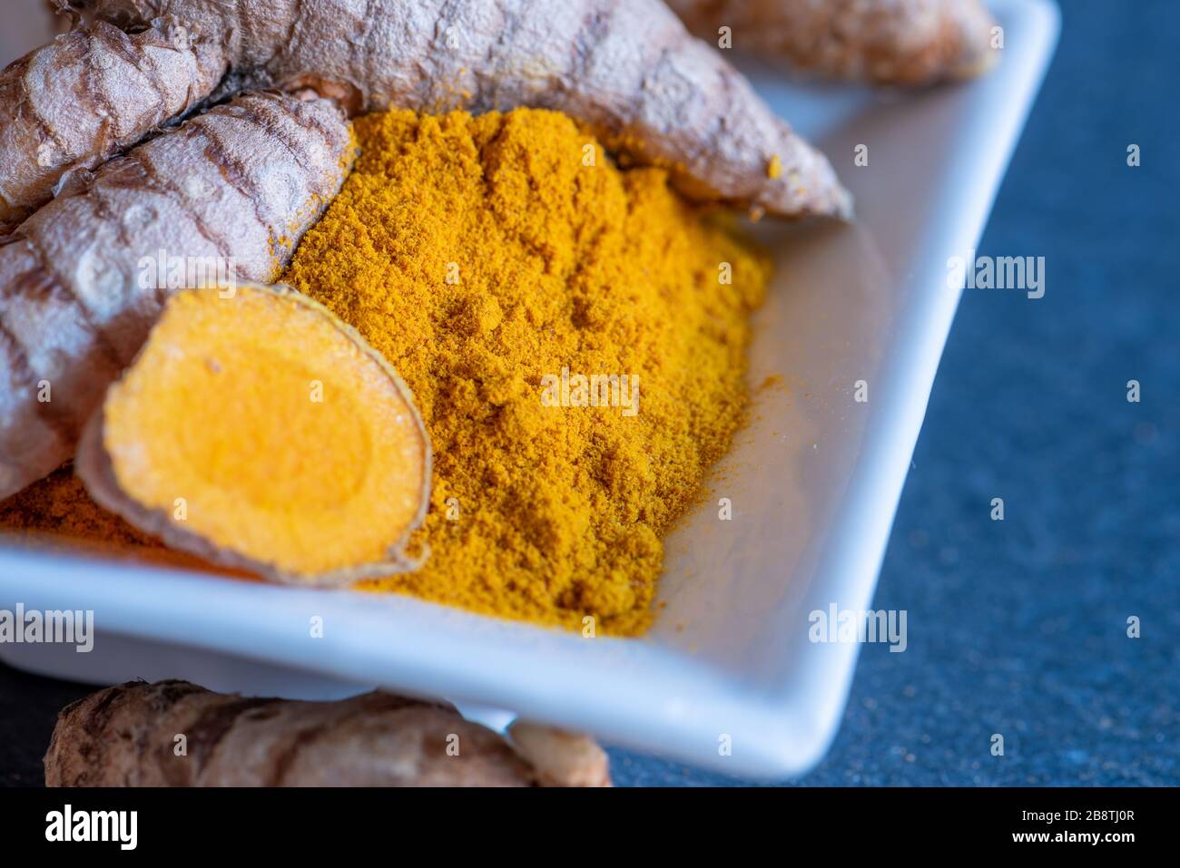 fresh turmeric and its dried powder Stock Photo - Alamy