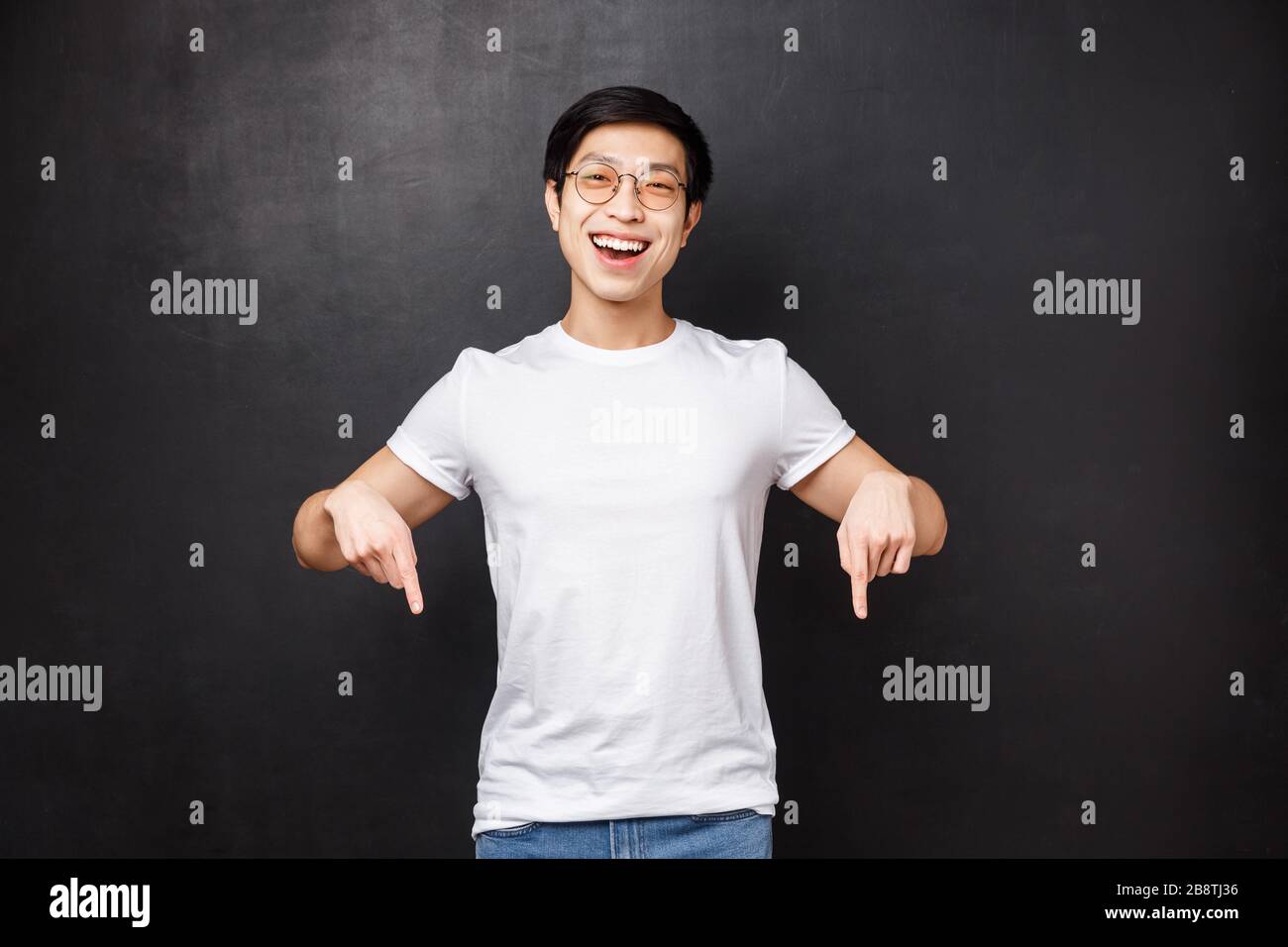 Happy pleased asian male customer bragging friends, showing his new ...