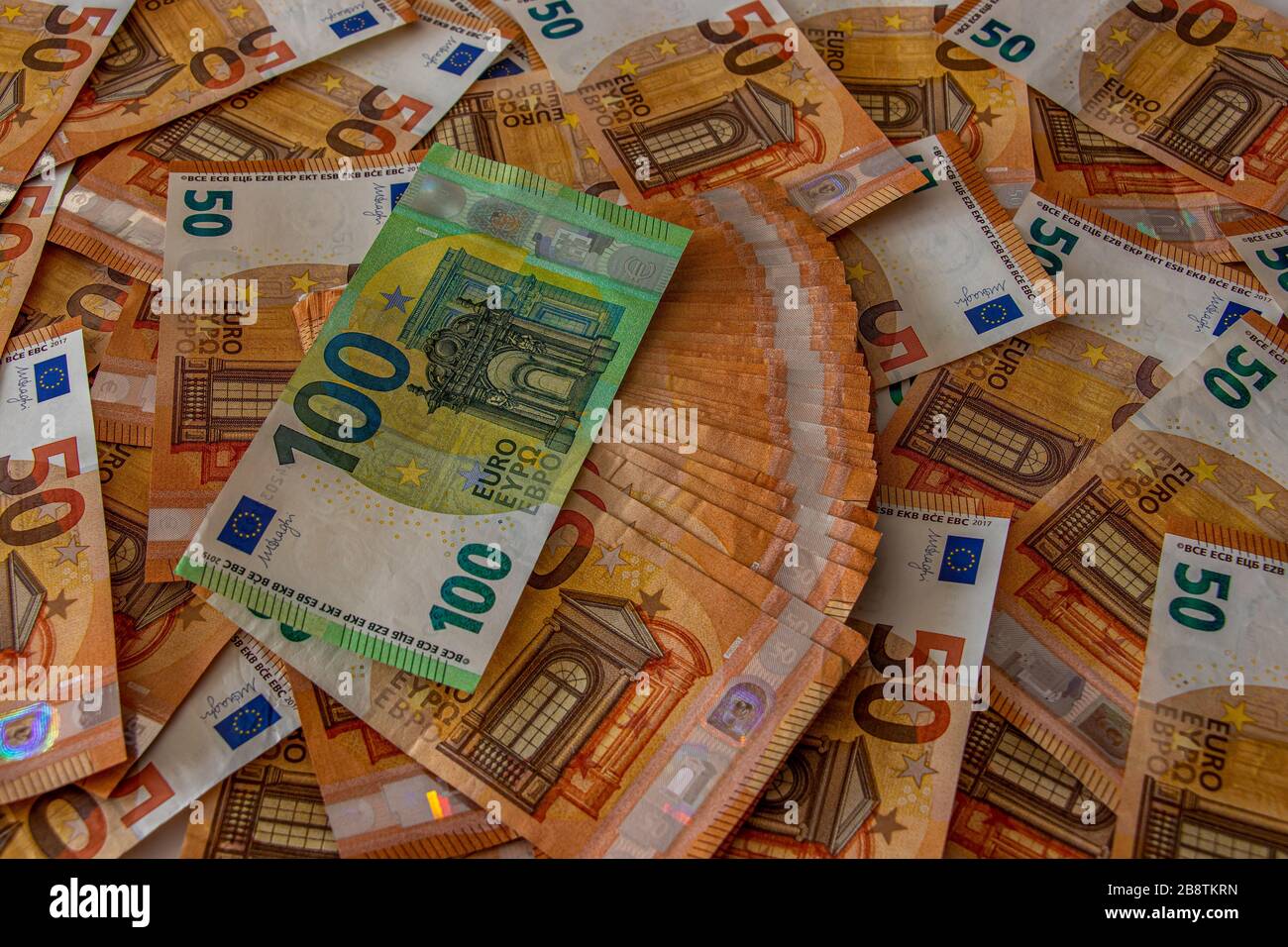 Different value euro notes of table Stock Photo - Alamy