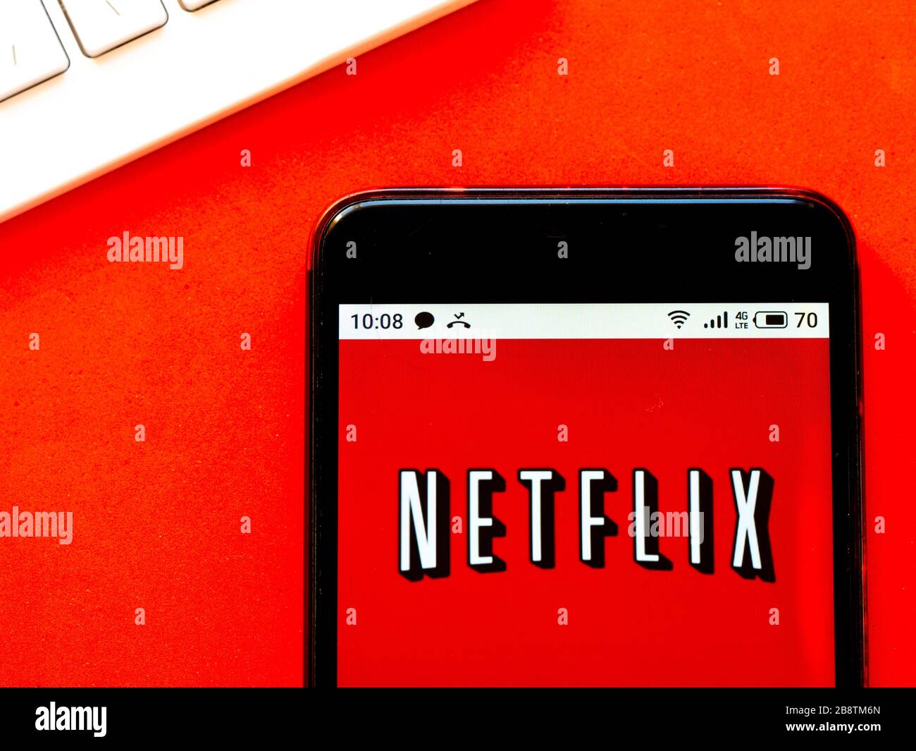 In this photo illustration Netflix logo is seen displayed on a ...