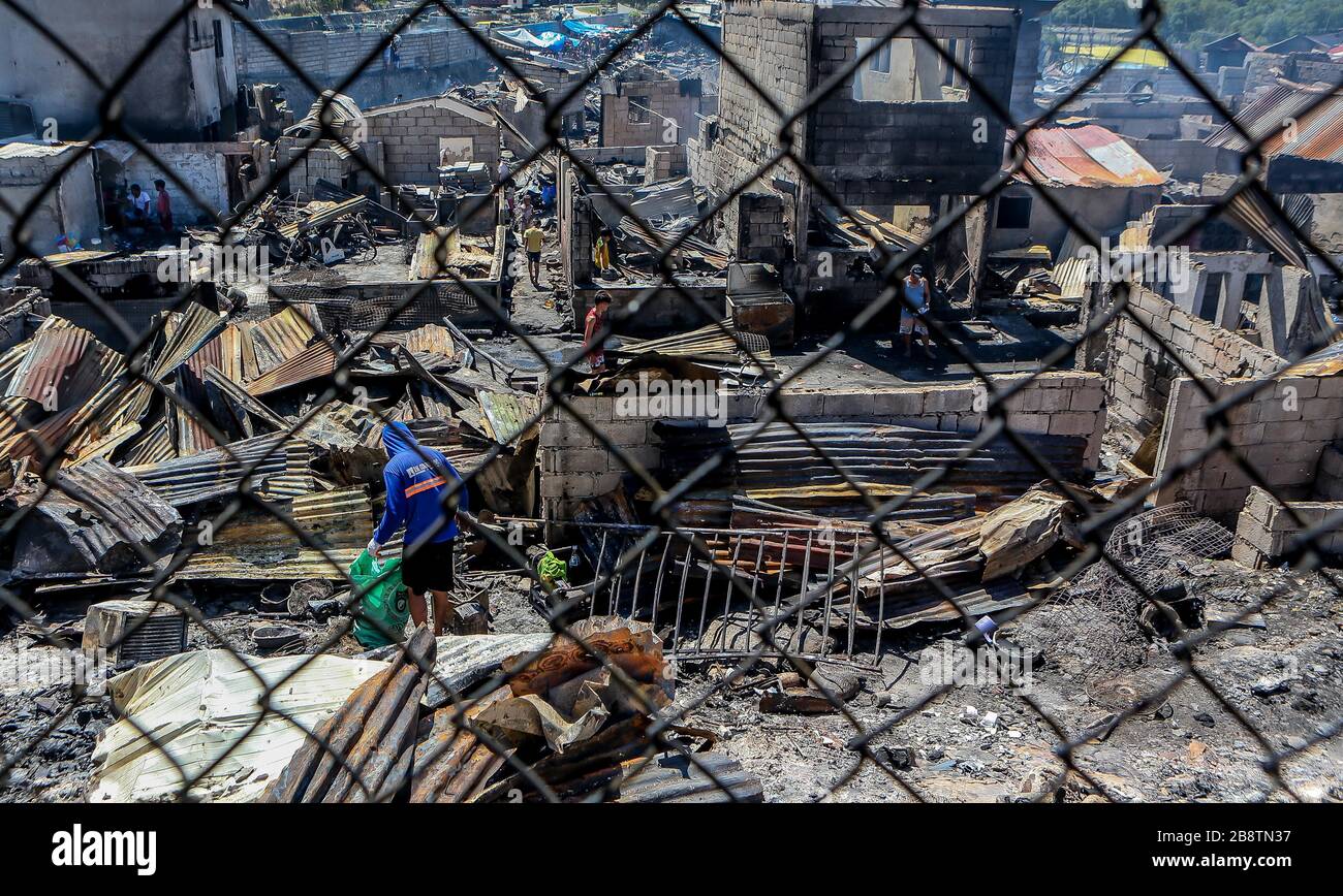 Bacoor City, Philippines. 23rd Mar, 2020. Residents look for their ...