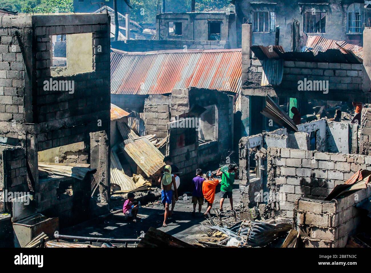 Bacoor City, Philippines. 23rd Mar, 2020. Residents look for their ...