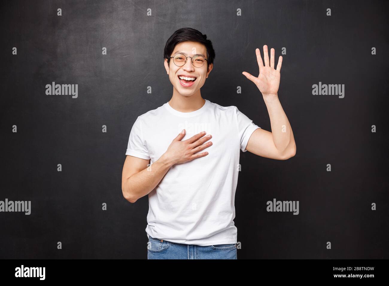 Informal greeting concept. Outgoing attractive young asian guy ...