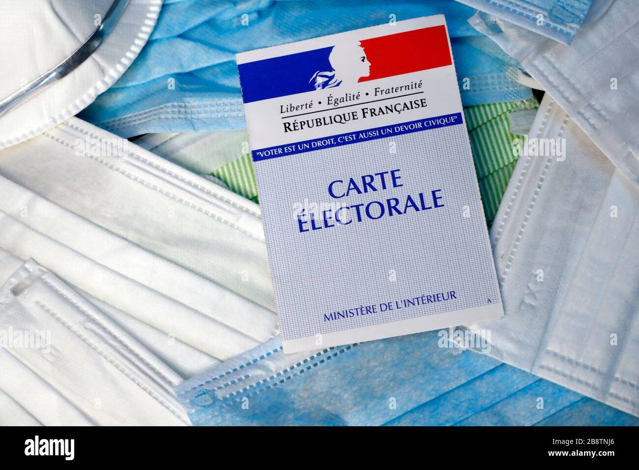 Masks and voter cards Stock Photo - Alamy