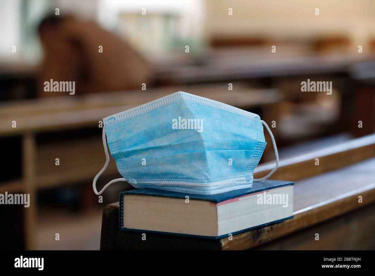 Mask and bible Stock Photo - Alamy
