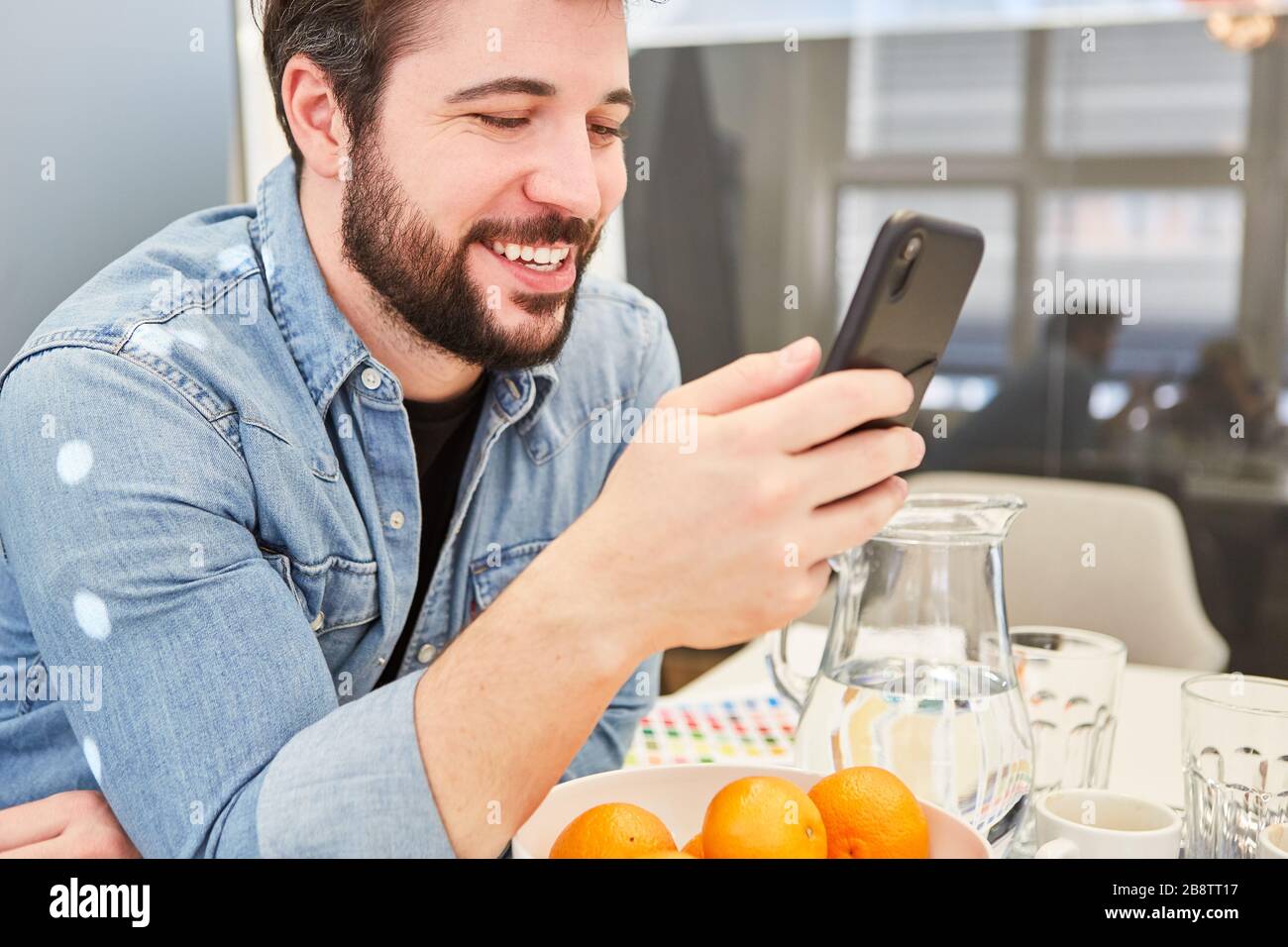 Business man is happy when chatting with a smartphone or texting Stock ...
