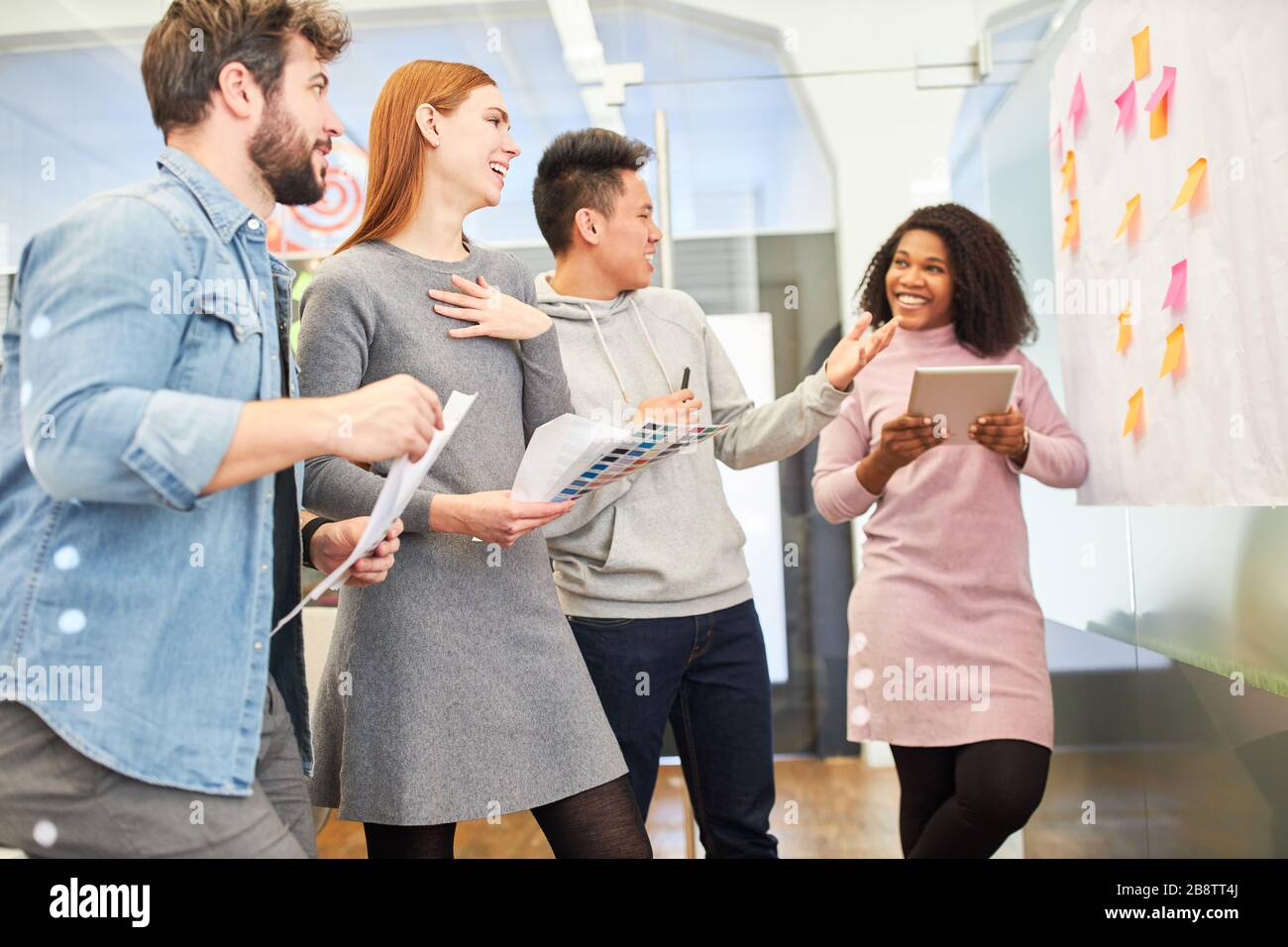 Dynamic creative team in the brainstorming workshop collects ideas for ...