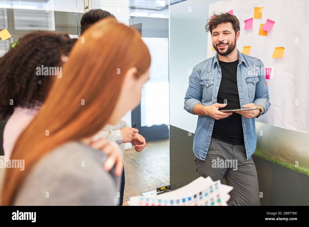 Business man gives a presentation on project development in the ...