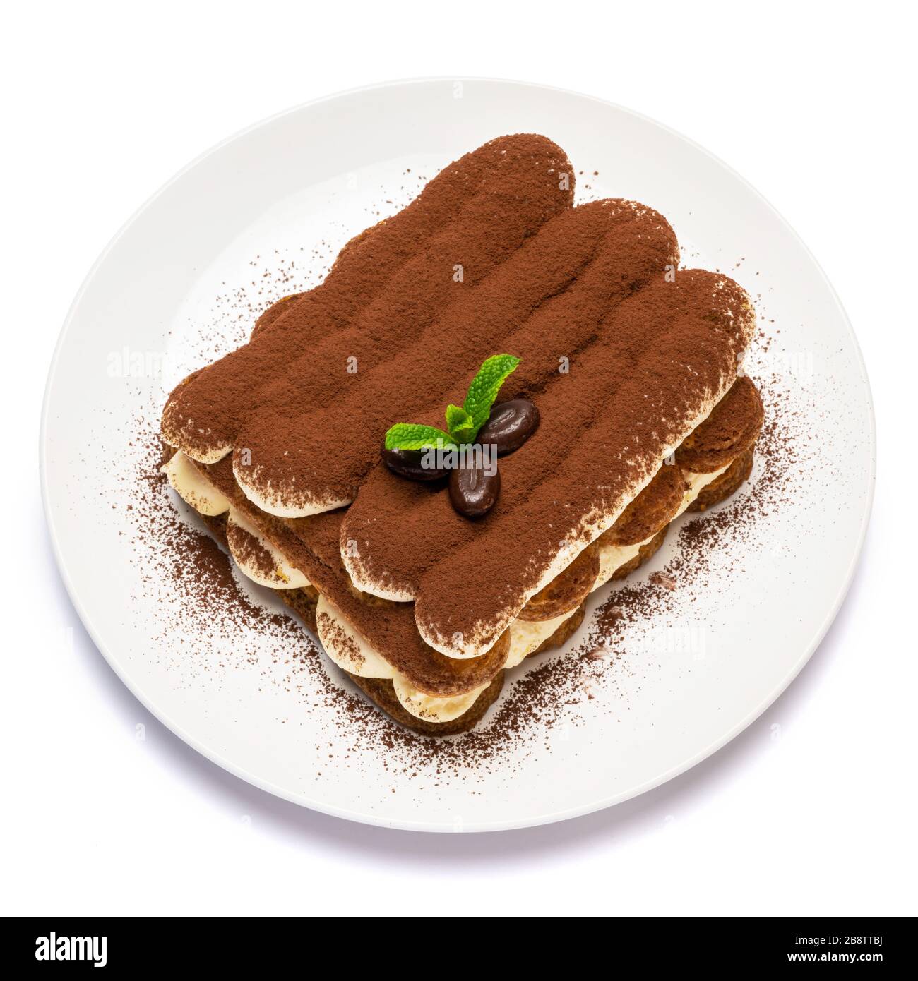 Classic tiramisu dessert on ceramic plate isolated on white background ...