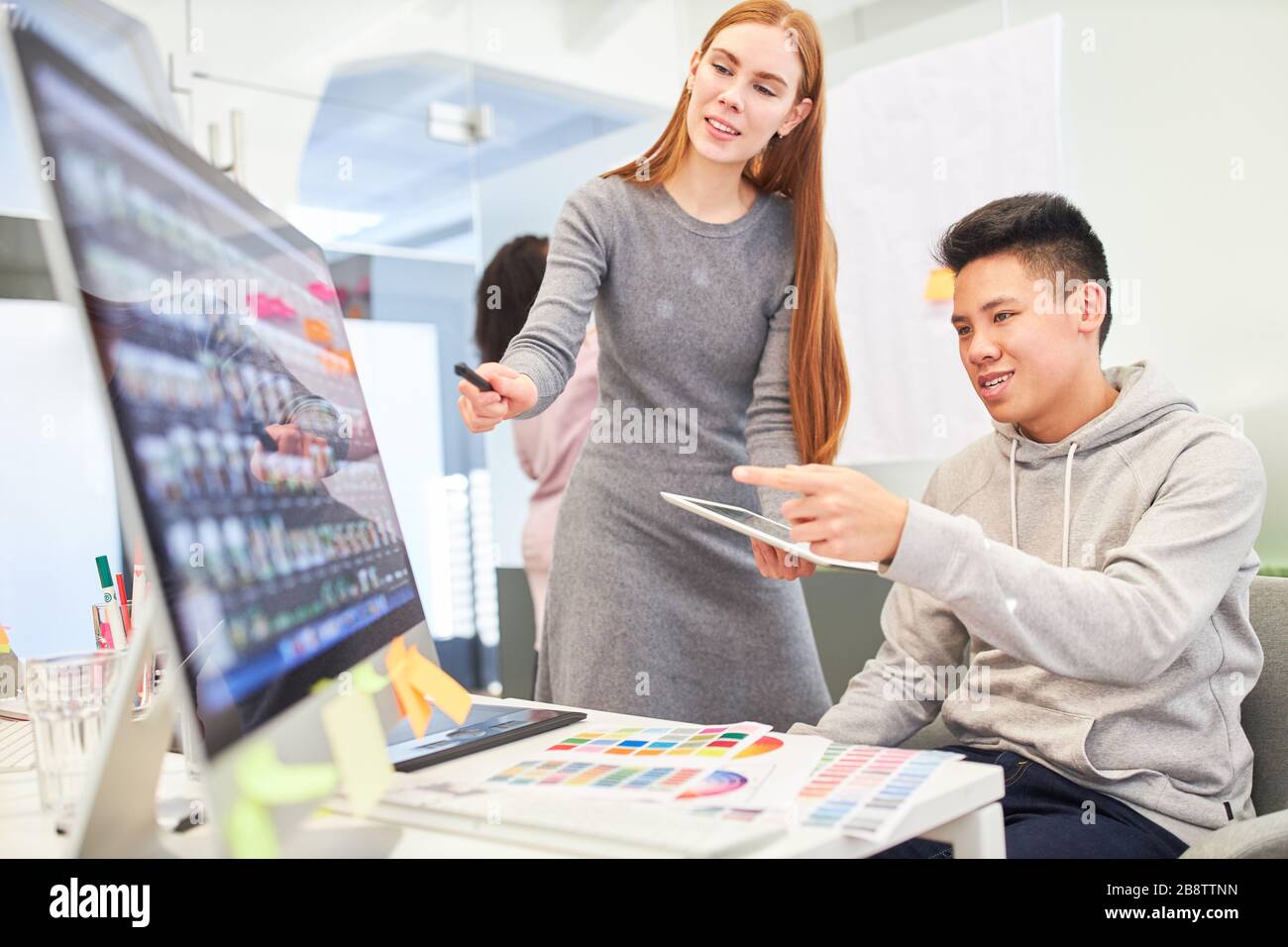 Programmers and women as web developers on the PC are working on a ...