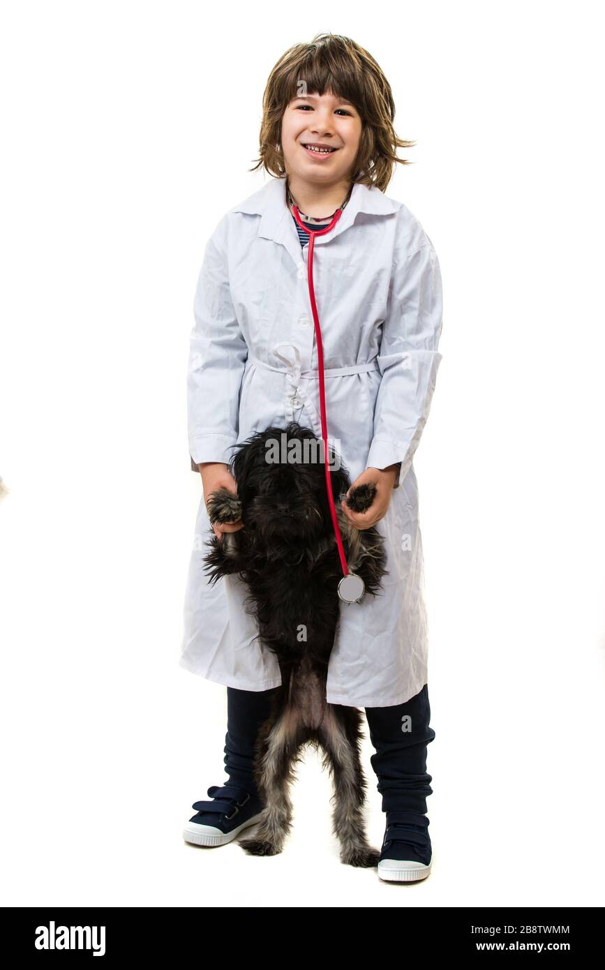 Smiling vet doctor boy wtih puppy dog isolated on white background ...