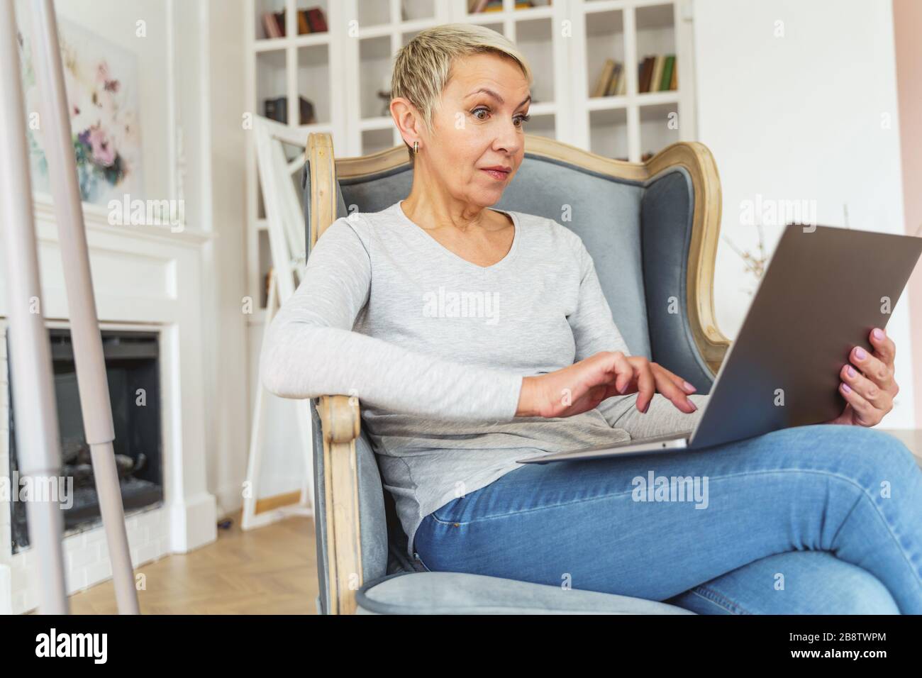 Attractive senior woman with an amazed look Stock Photo - Alamy