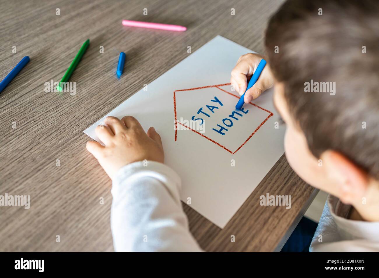 Little kid with Stay Home draw. Coronavirus concept Stock Photo - Alamy