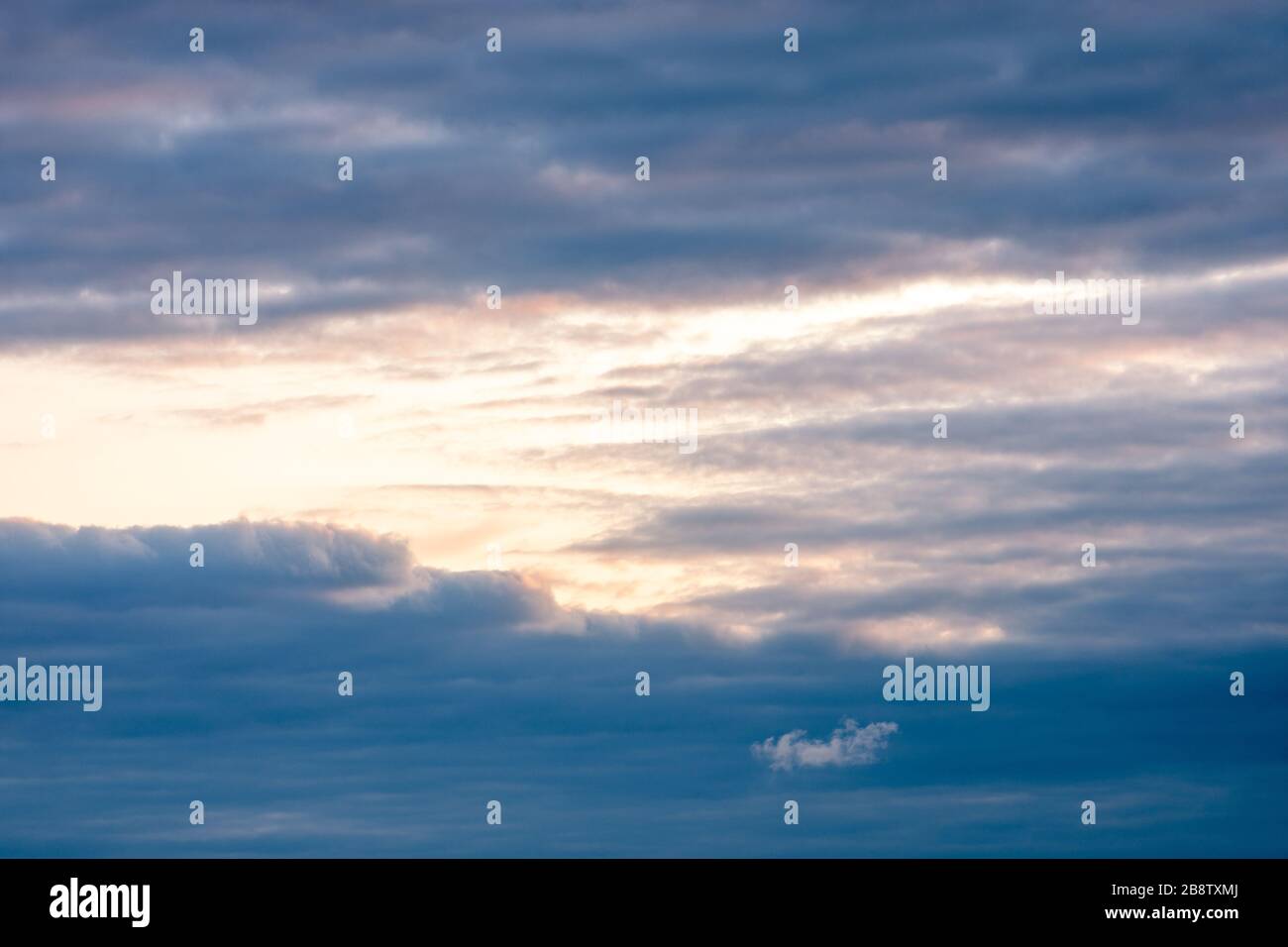 texture of the sky clouds and rays of sun on a background of blue sky ...