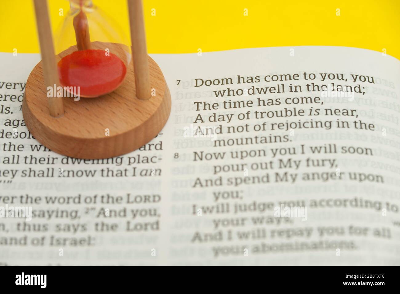 Hourglass on top of an open Holy Bible in the Book of the Prophet ...