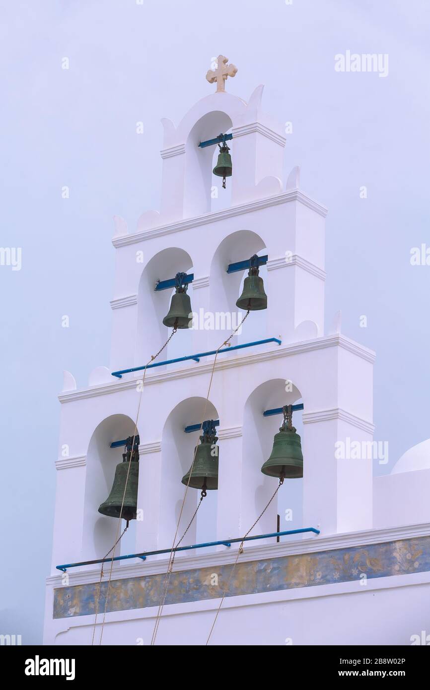 Greek orthodox church bell tower against blue sky, Megalohori ...