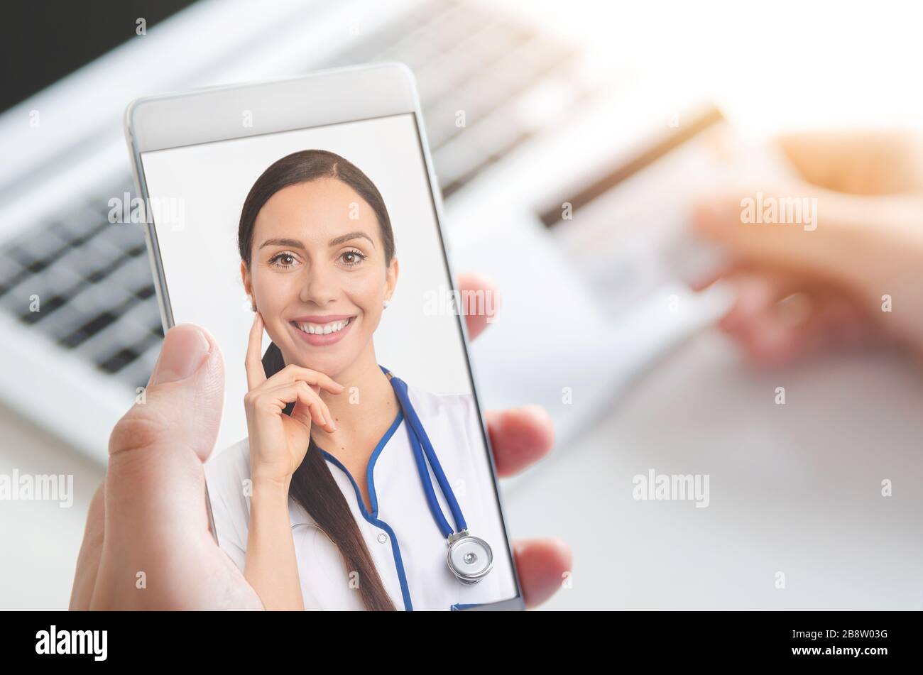 Doctor woman listening phone hi-res stock photography and images - Alamy