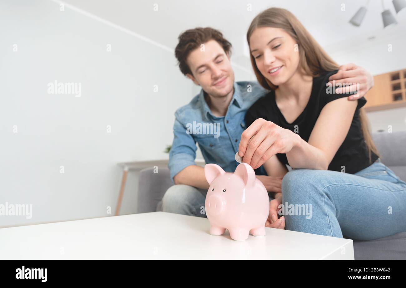 Home budget, family finance with piggy bank Stock Photo - Alamy