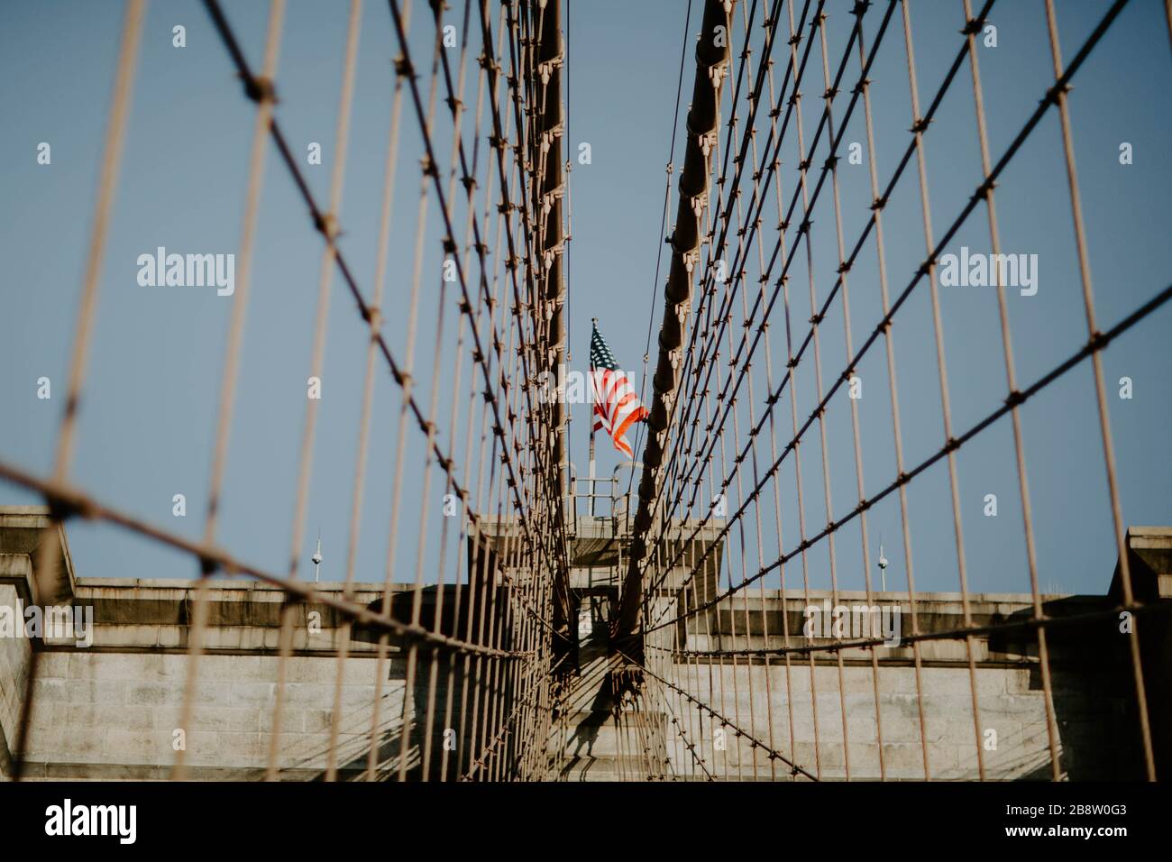 American Flag Flying Above Brooklyn Bridge Stock Photo - Alamy