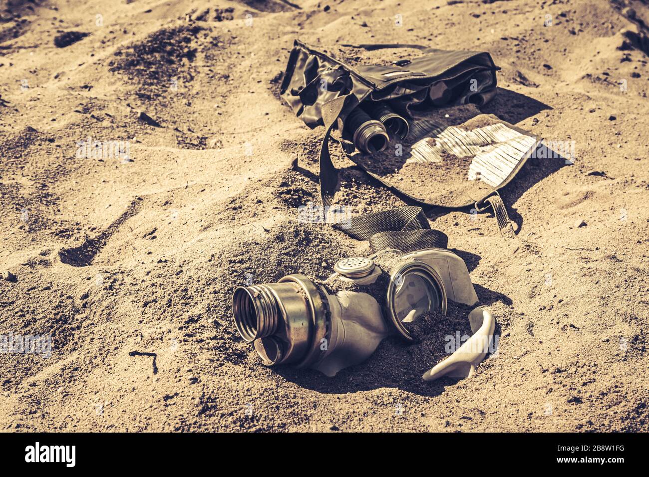 Damaged gas mask in the toxic and danger desert Stock Photo - Alamy
