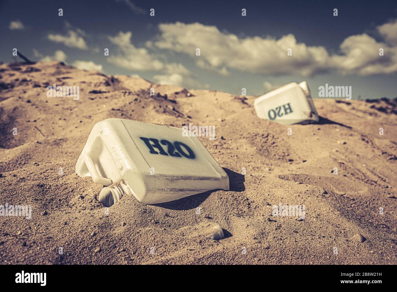 Contaminated water cans filled with toxins and sand Stock Photo - Alamy