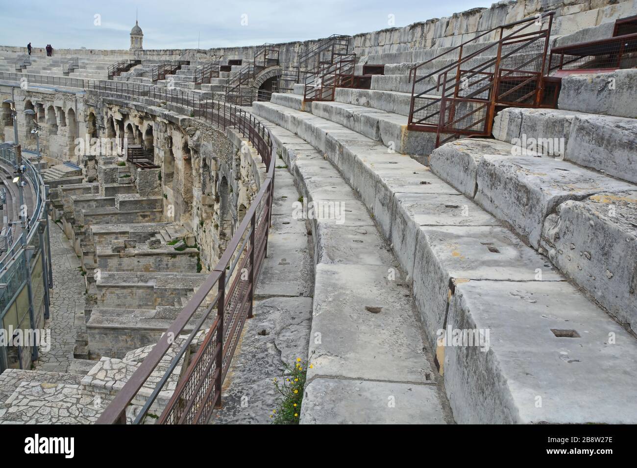 The upper tier of seats in an ancient Roman Amphitheatre at Nimes in ...