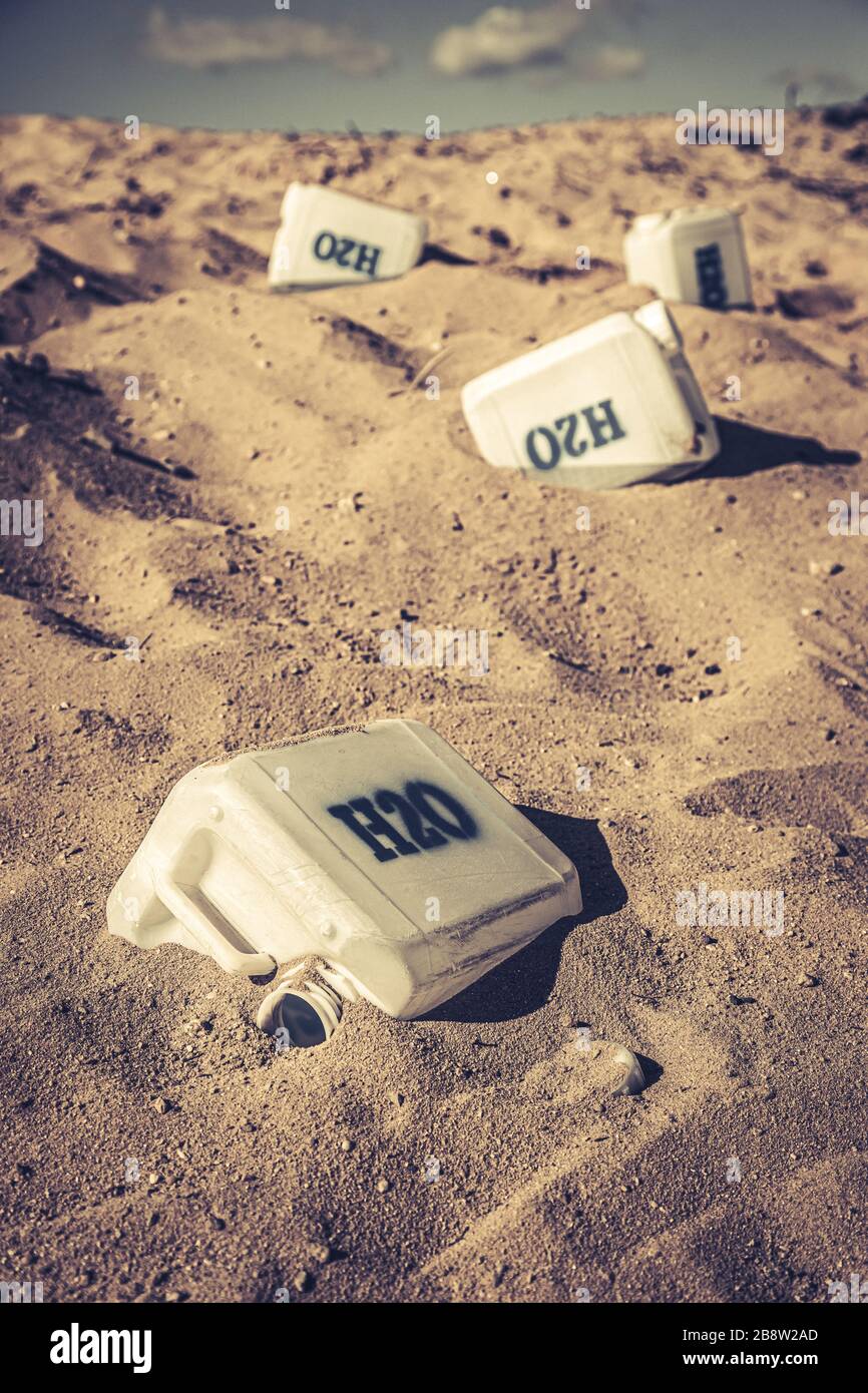 Contaminated water cans in the sunburned toxic desert Stock Photo - Alamy