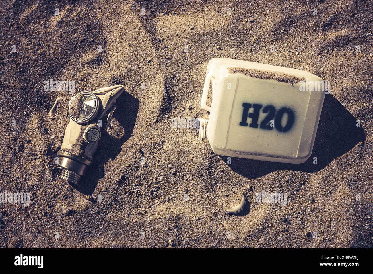 Plastic water cans as a symbol of polluted earth Stock Photo - Alamy
