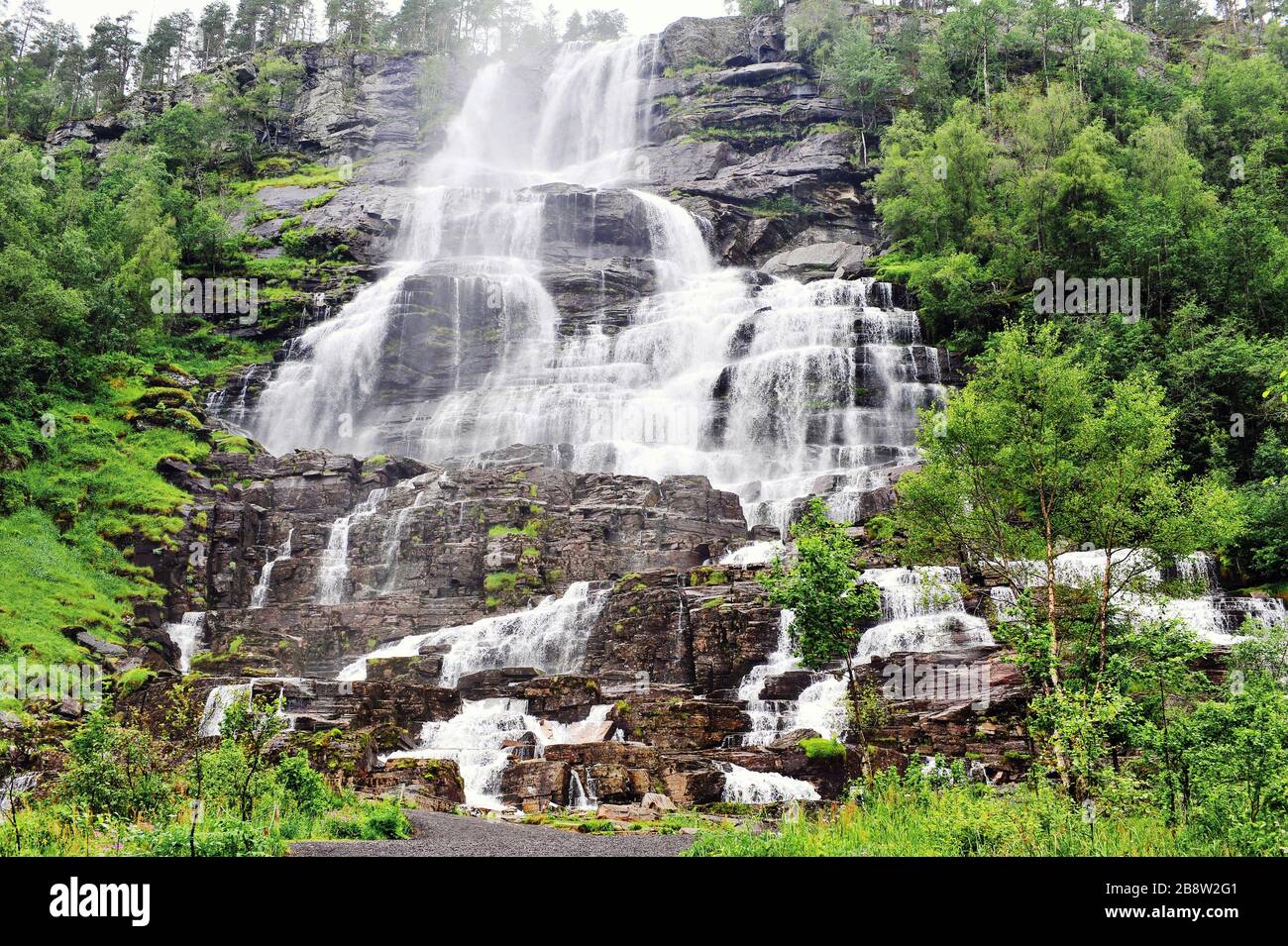 Scenic view of the waterfall in norwegian forest, northern Europe Stock ...