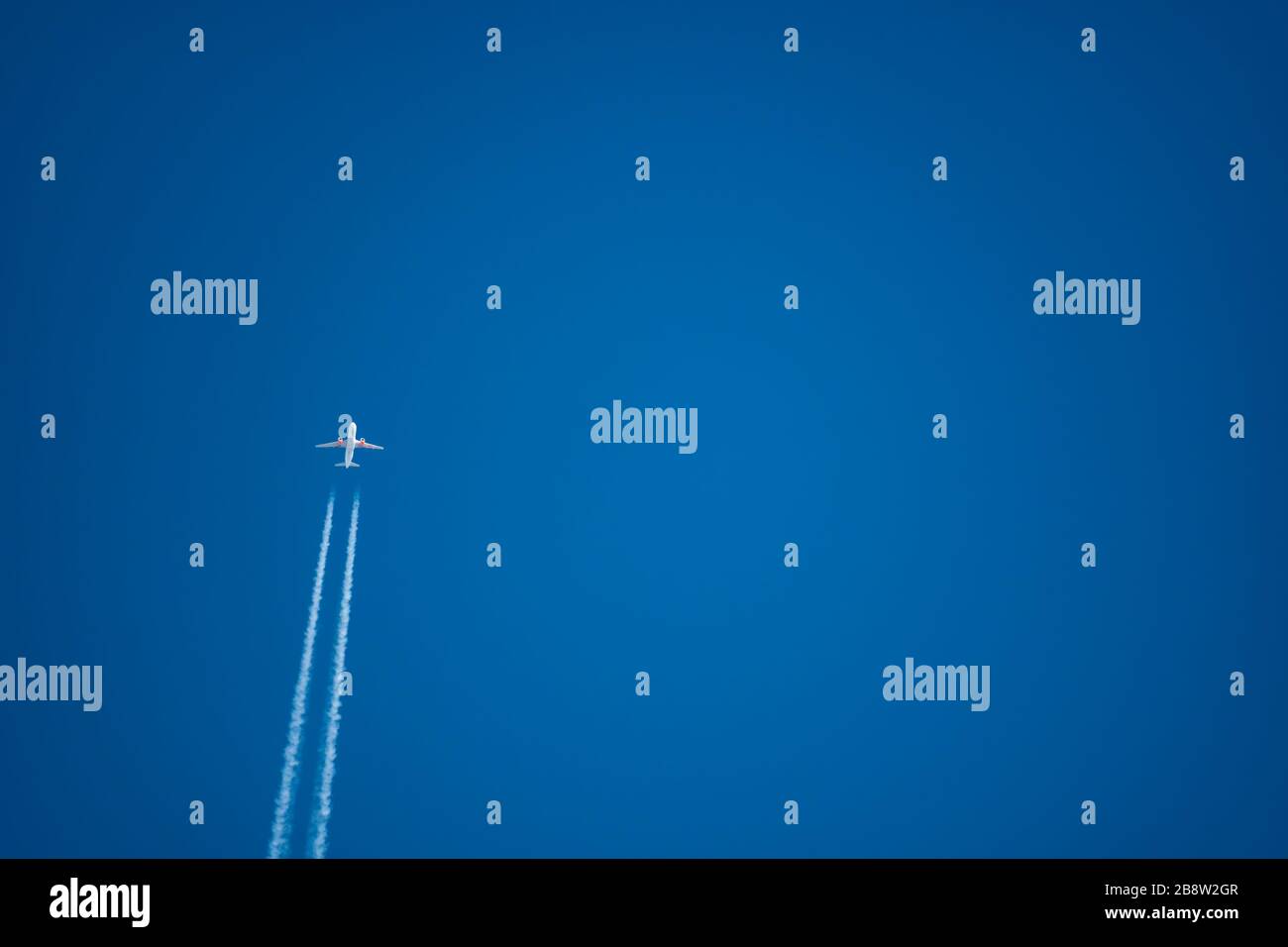 Jet plane trail crossing the sky from bottom left to upper side Stock ...