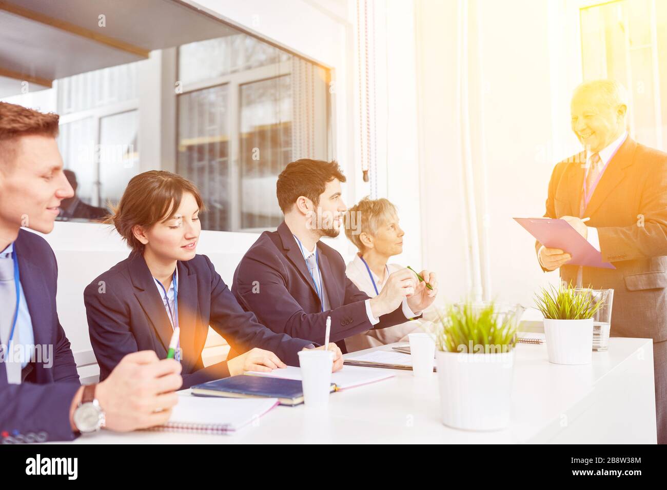 Business workshop seminar with group of business people in conference ...