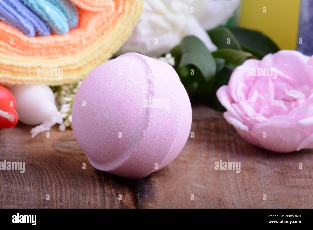 Spa theme with candles and flowers on wooden background Stock Photo - Alamy