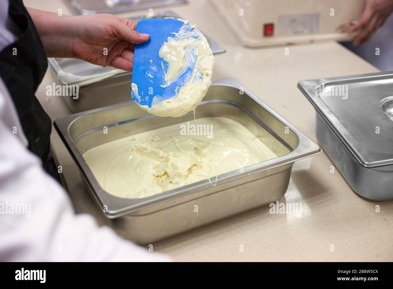 Making chocolate. . Chocolate factory. Liquid chocolate in a pan Stock ...