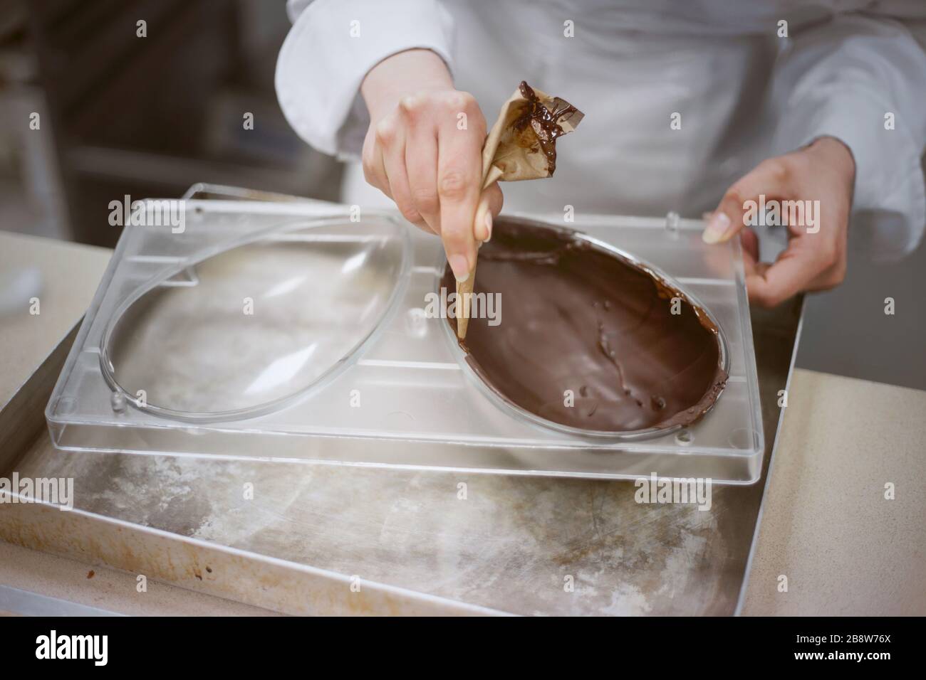 Making chocolate. Making chocolate easter eggs. Chocolate factory ...