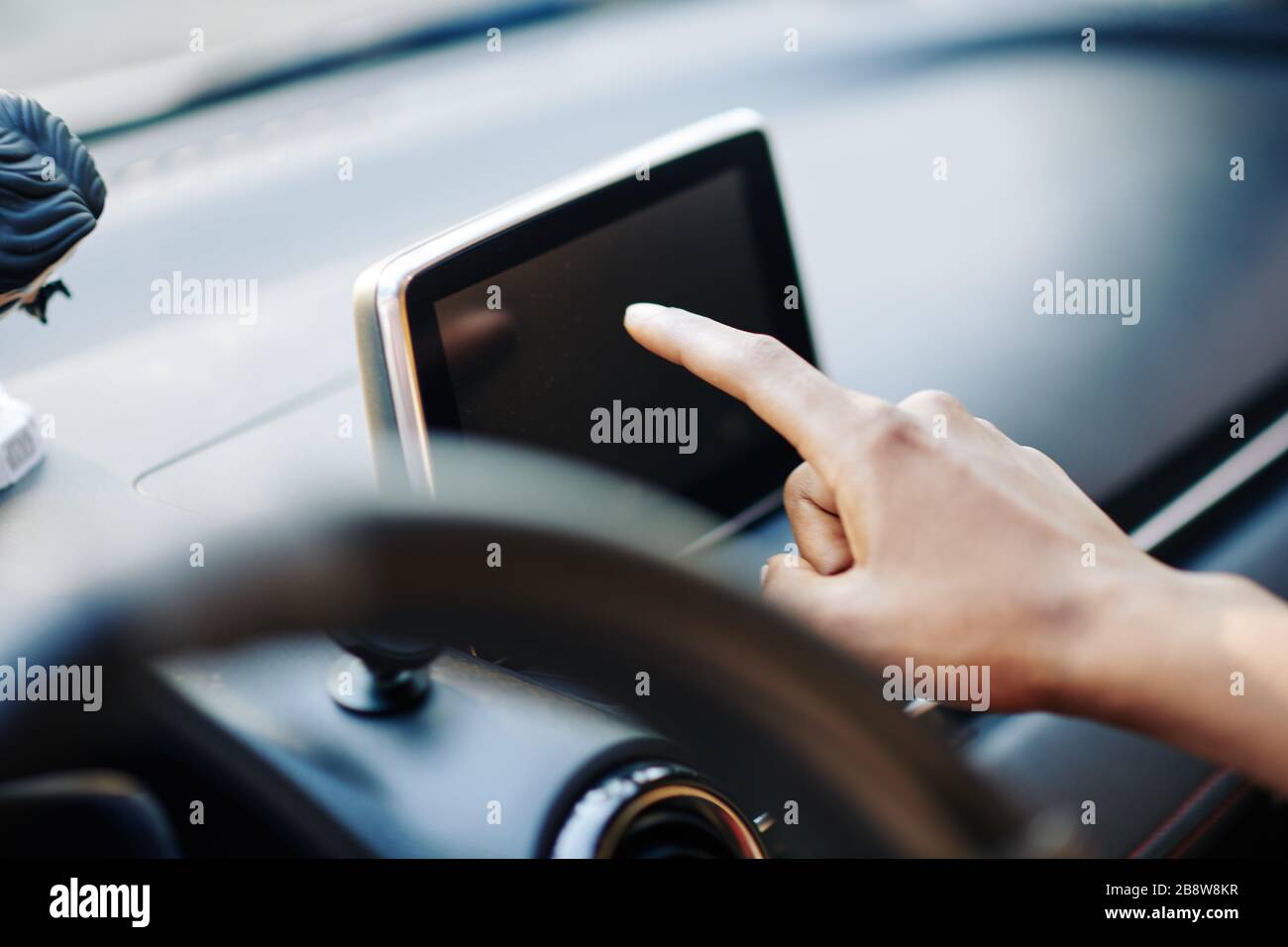 Close-up image of woman using application on tablet computer when ...