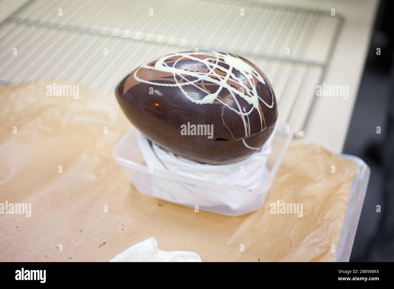 Making chocolate. Making chocolate easter eggs. Chocolate factory Stock ...