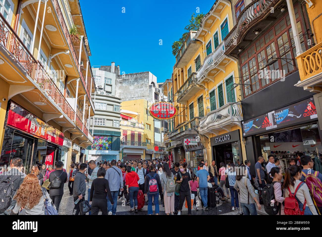 Crowded narrow street in the historic center. Macau, China Stock Photo ...