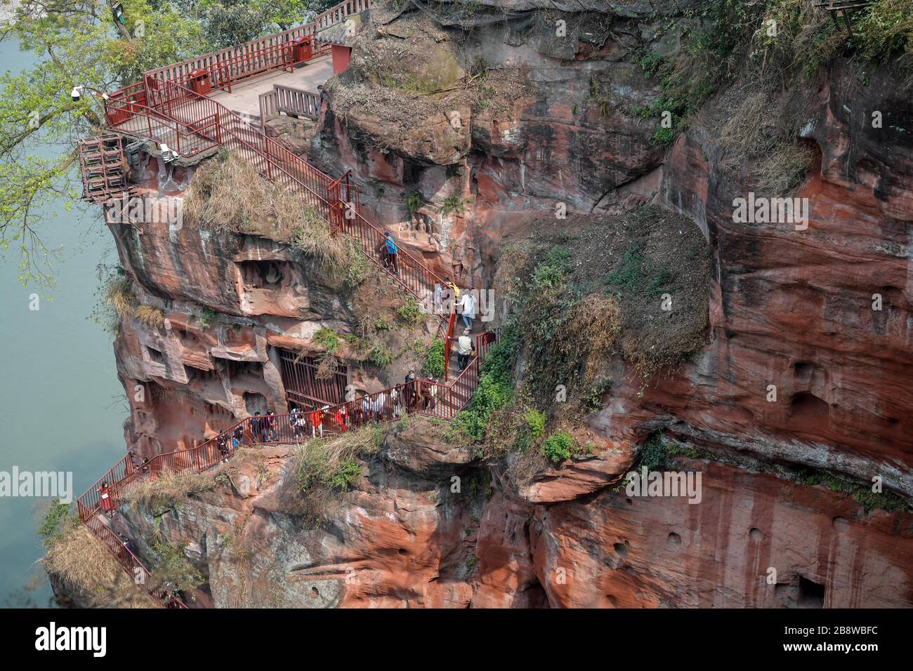 Leshan, China's Sichuan Province. 23rd Mar, 2020. Tourists walk at ...