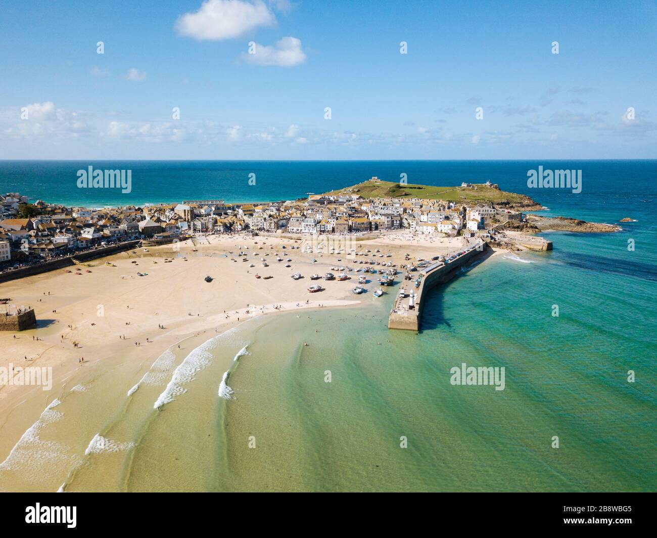Aerial View of St Ives, a wide sandy beach and sheltered harbour with ...