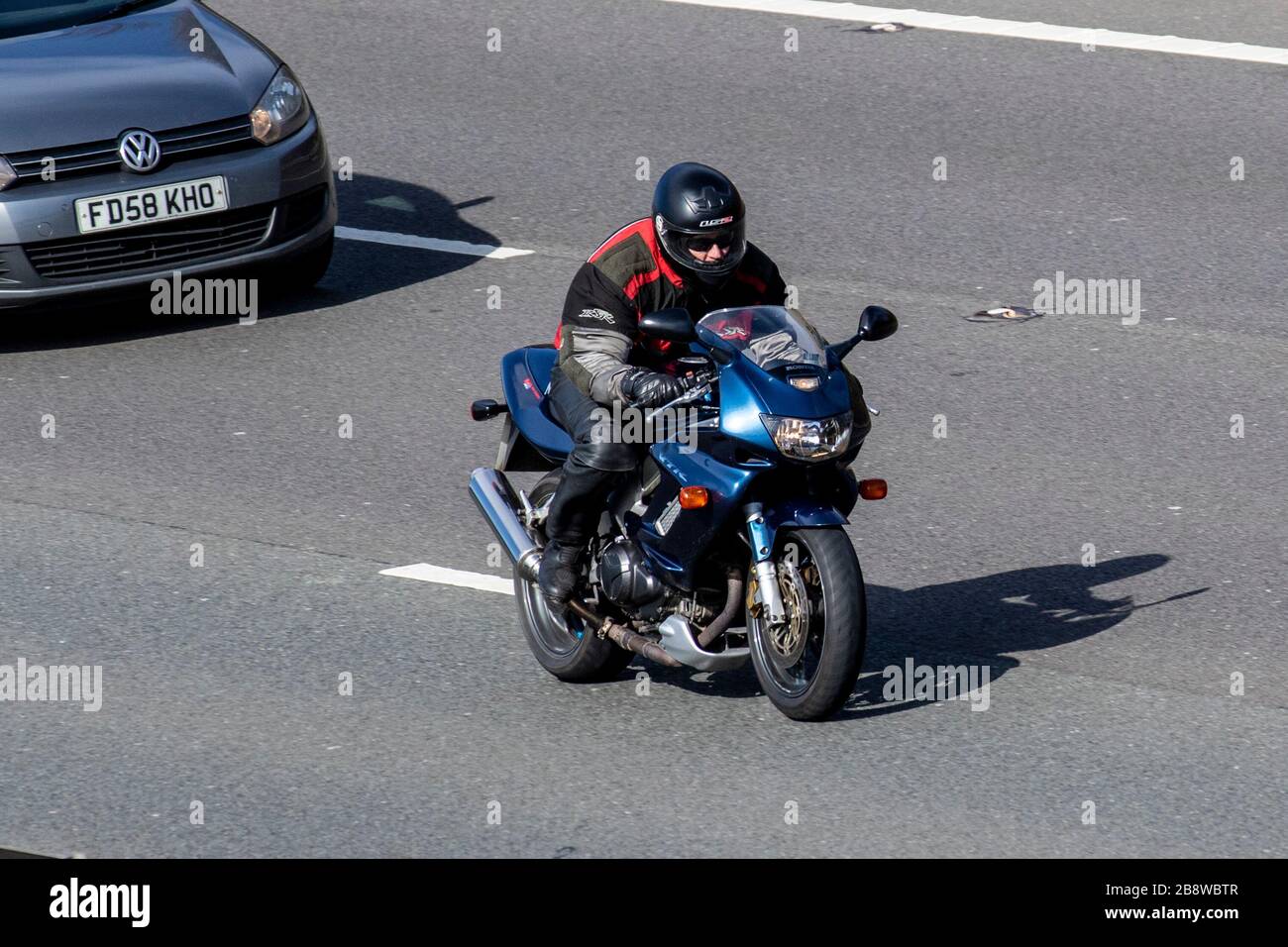 Honda VTR motorbike rider; Vehicular traffic, two wheeled transport ...