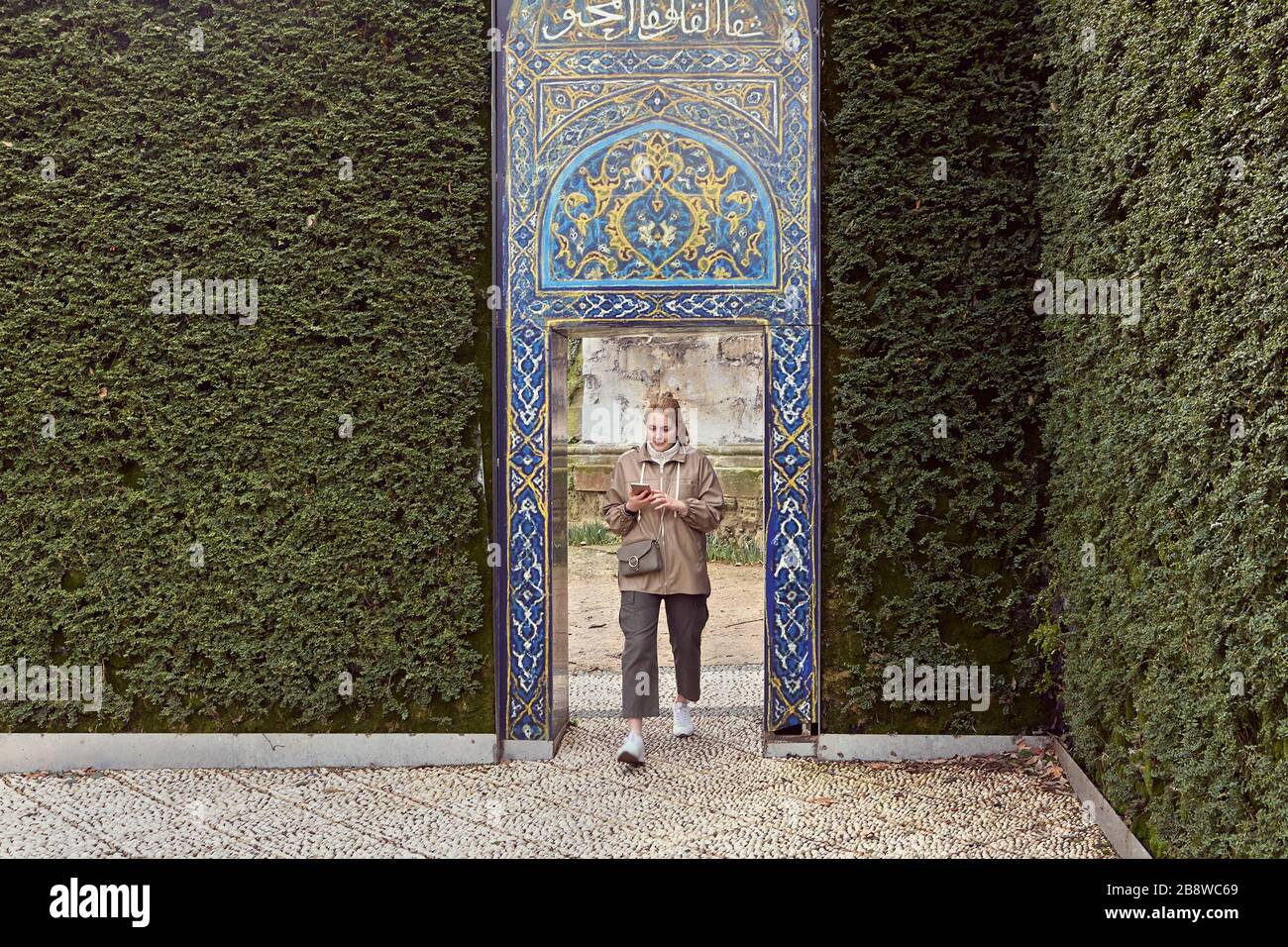 Traveling in Istanbul, a young Caucasian woman walks in the park during ...