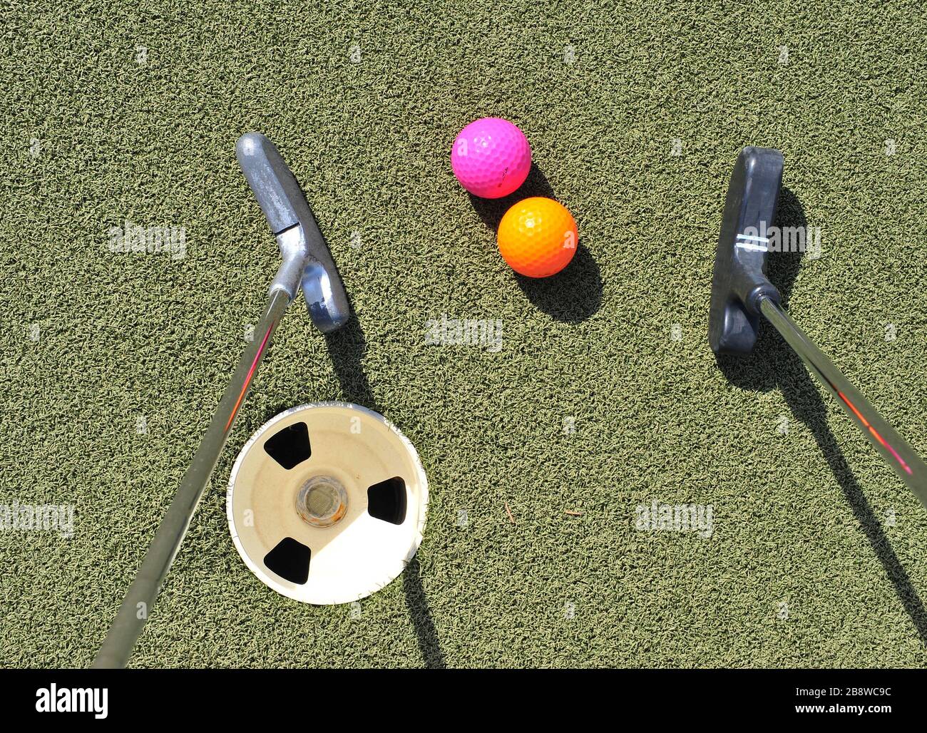 Two sticks and colorful ball for mini golf playing, top view Stock ...