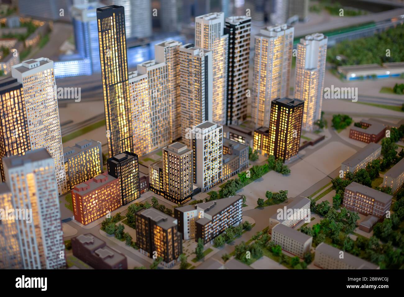 small town architecture with skyscrapers in evening lighting. City ...