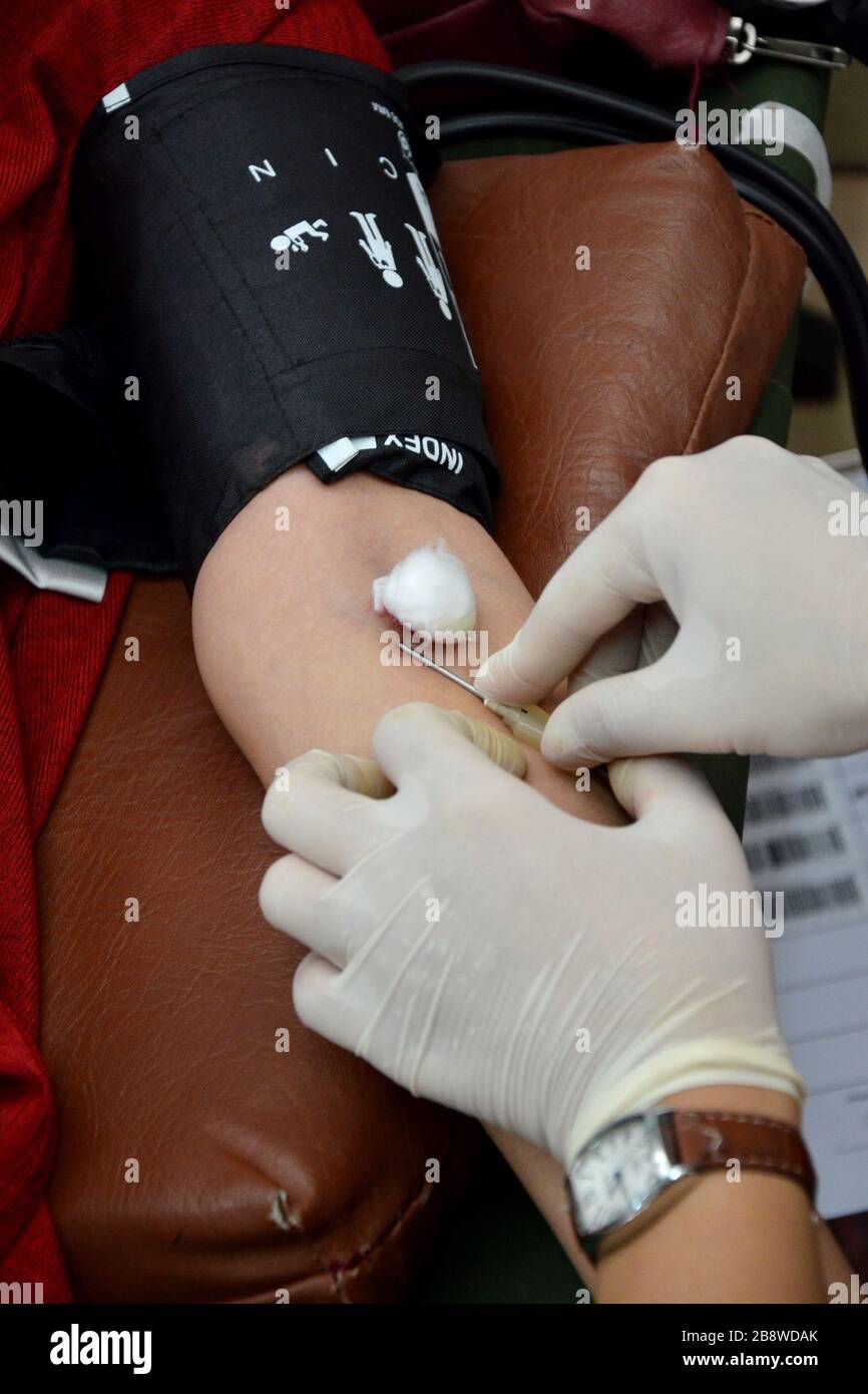 A close up shot of a blood suction process in a blood donation clinic ...