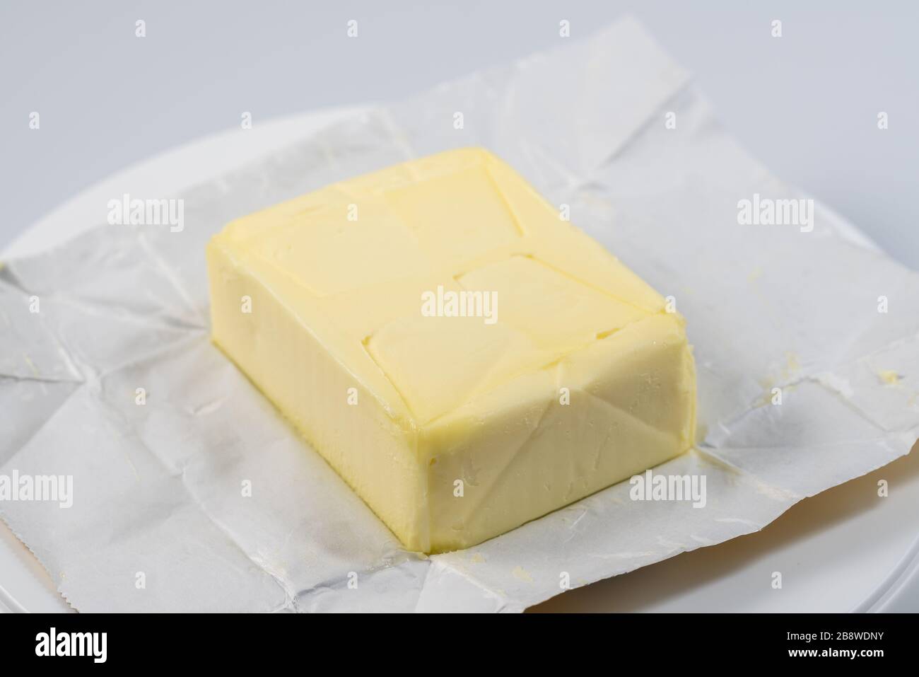 The wrapped butter is open for proper nutrition with amino acids for ...