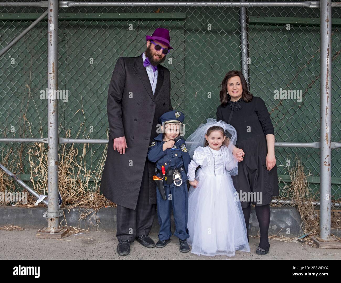 Posed Portrait Of A Jewish Family In Their Purim Costumes In
